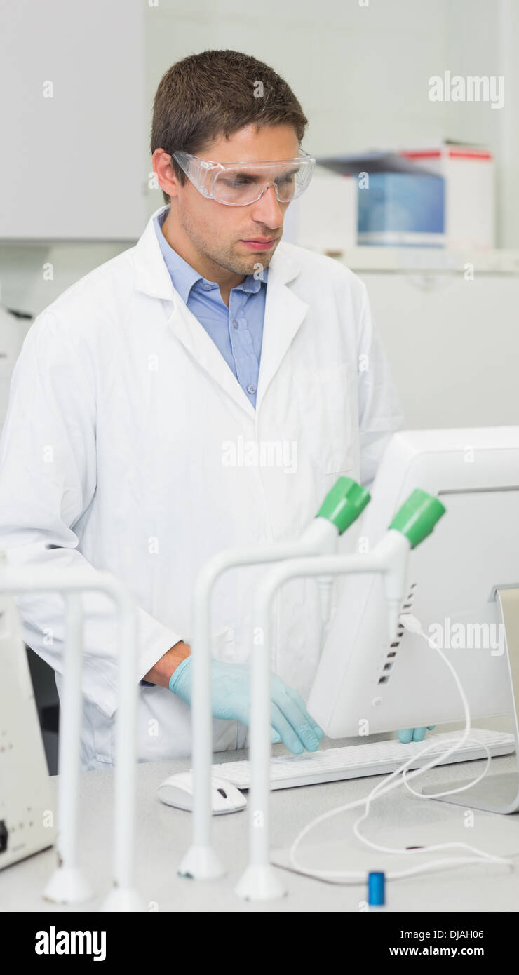 Male researcher using computer in lab Stock Photo - Alamy