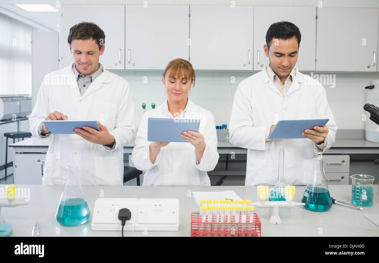 Team scientists examine test tubes hi-res stock photography and images ...