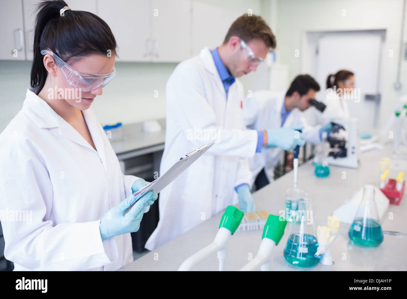 Researchers carrying out experiments in the lab Stock Photo - Alamy
