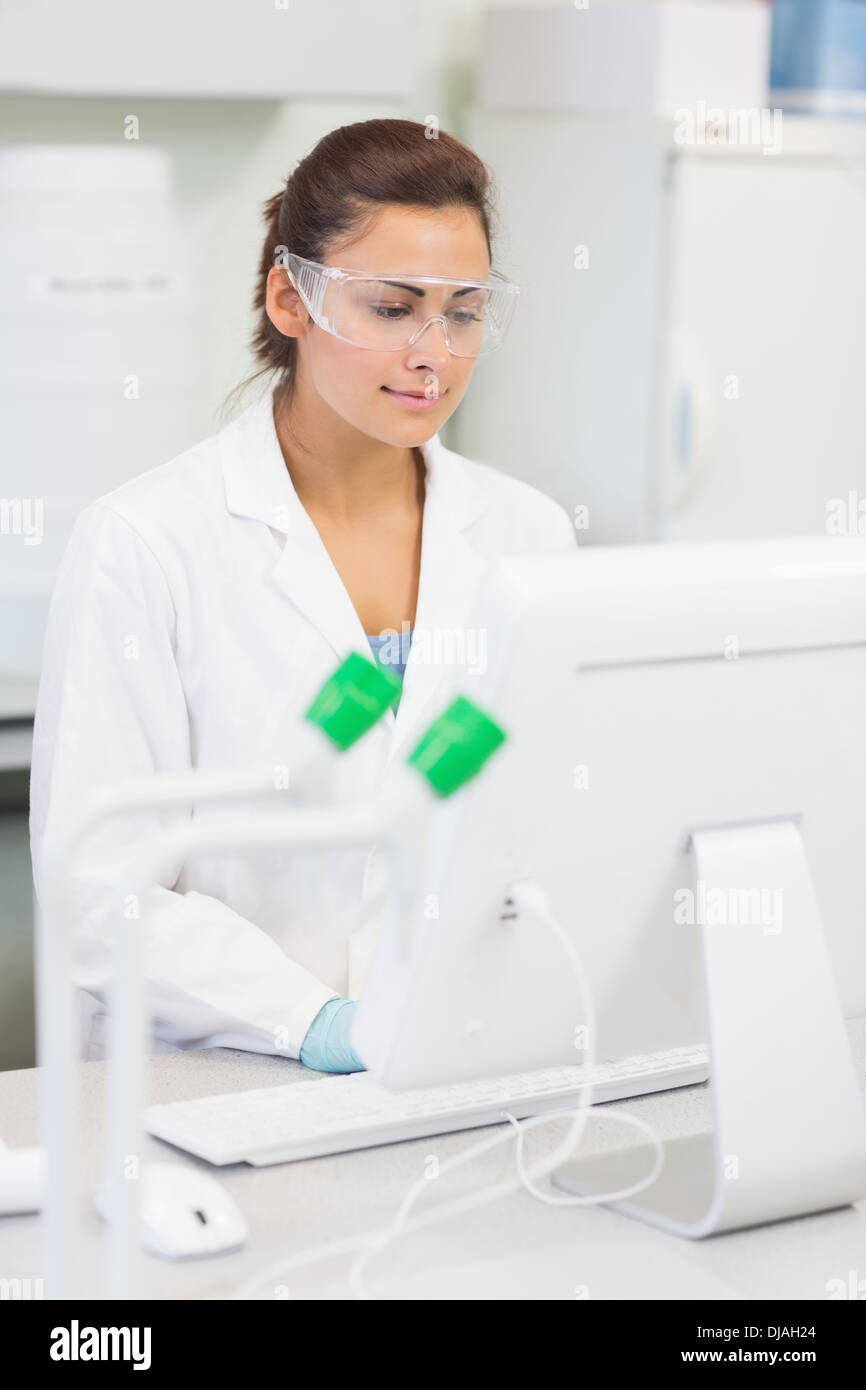 Female researcher using a computer in the lab Stock Photo - Alamy