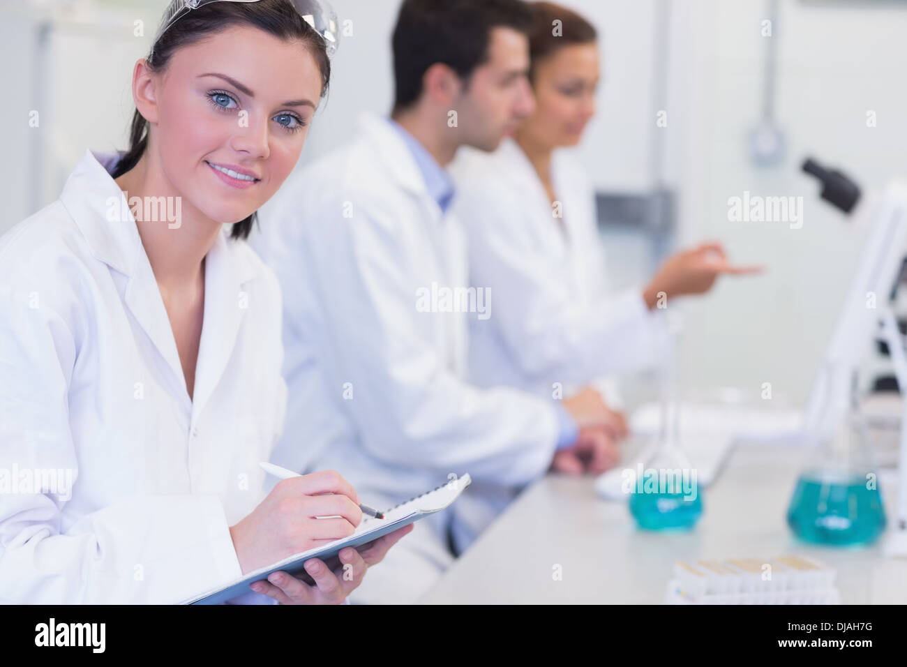 Female researchers standing holding hi-res stock photography and images ...