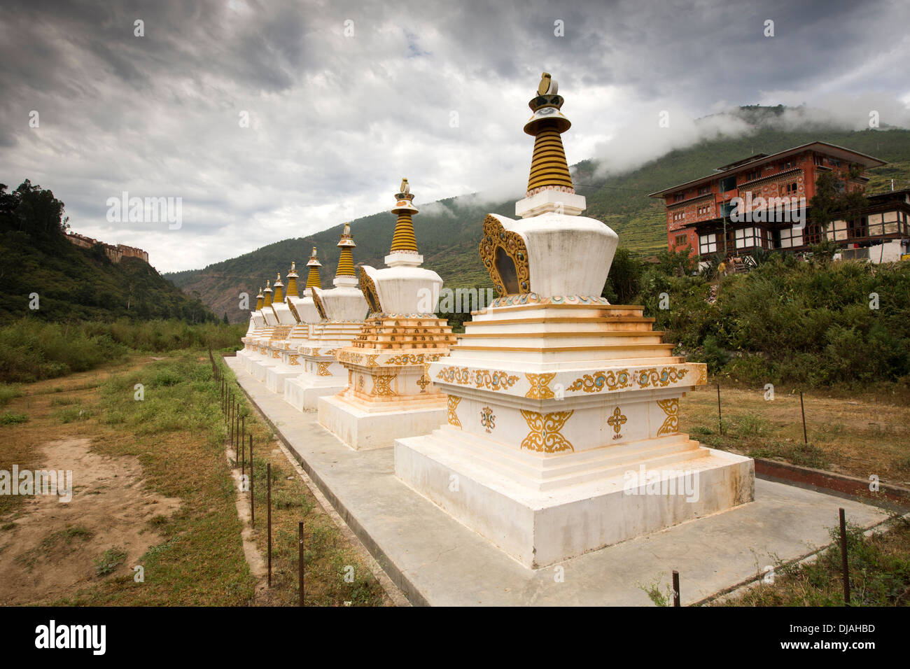 Bhutan, Wangdue Phodrang, line of Buddhist chortens beside river Stock ...
