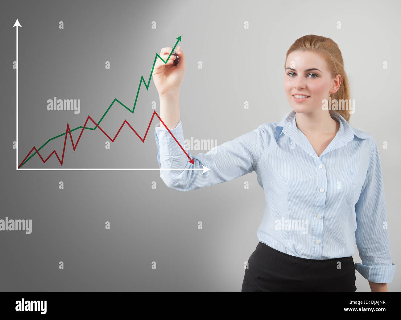 Handwritten chart by businesswoman on glass Stock Photo - Alamy