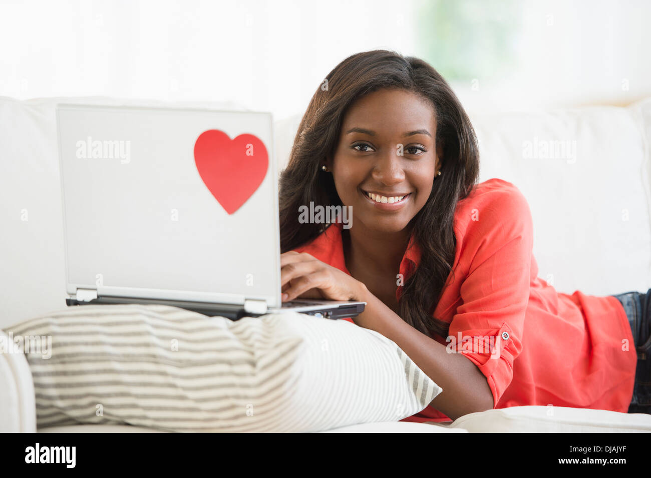 Black woman typing at computer hi-res stock photography and images - Alamy