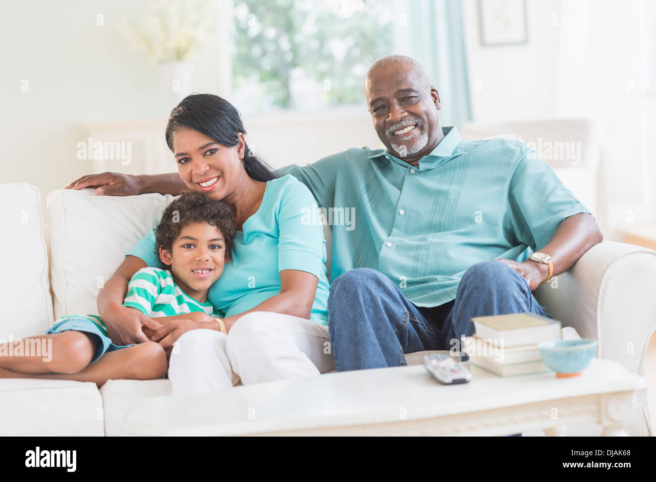 Three generations family watching tv hi-res stock photography and ...