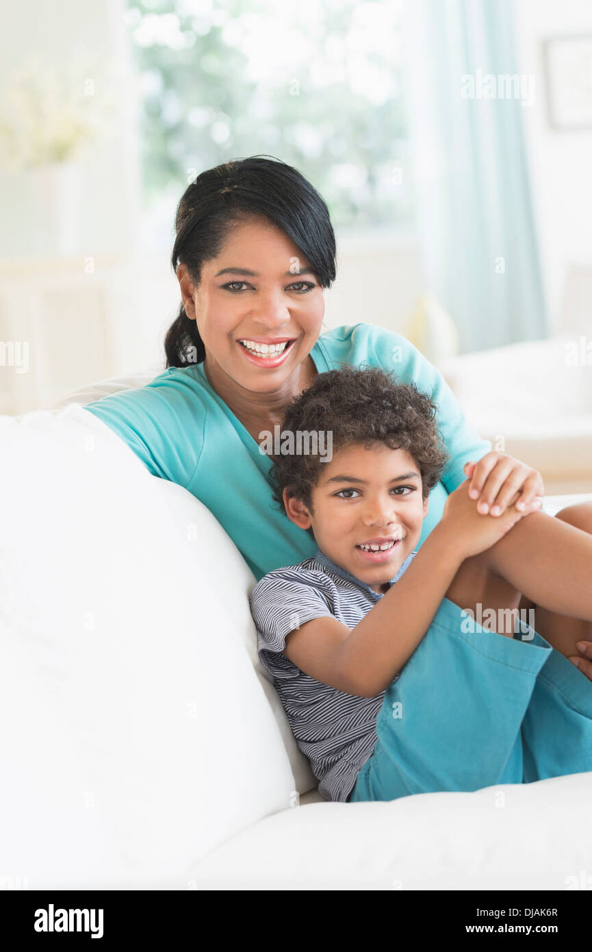 Mother and son sitting on couch hi-res stock photography and images - Alamy