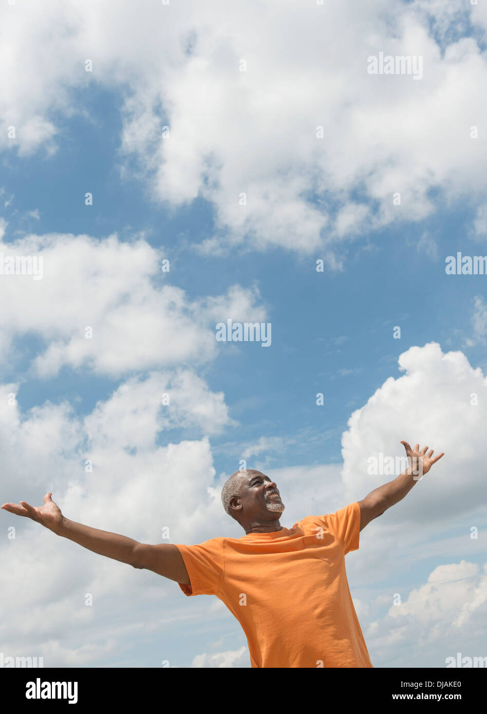 Black man with arms outstretched outdoors Stock Photo - Alamy