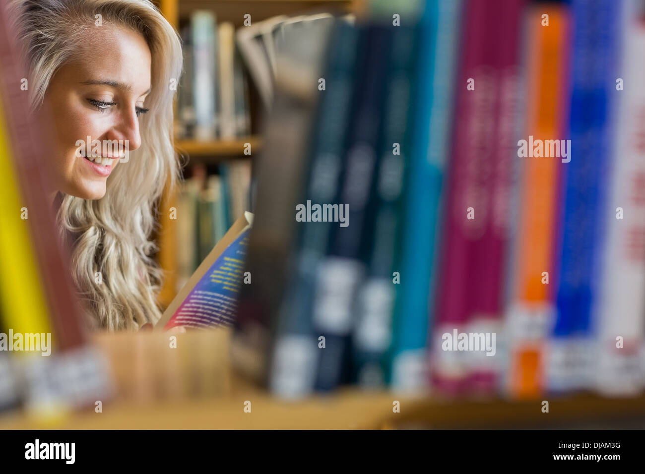 Smiling female student learning reading hi-res stock photography and ...