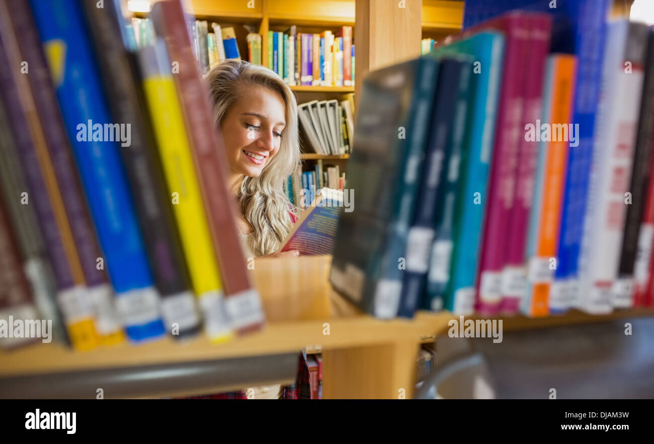 Smiling female student learning reading hi-res stock photography and ...