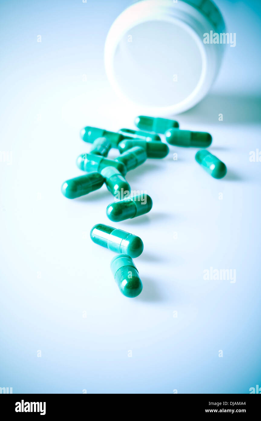 green medicine capsules and box Stock Photo - Alamy