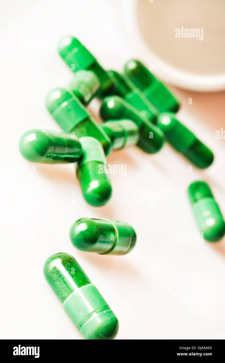 green medicine capsules Stock Photo - Alamy