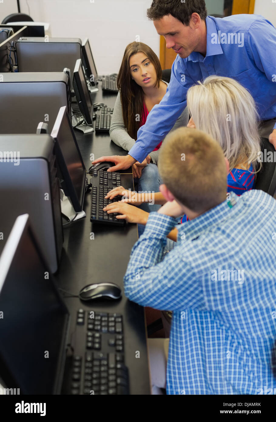 Teacher students classroom monitor hi-res stock photography and images ...