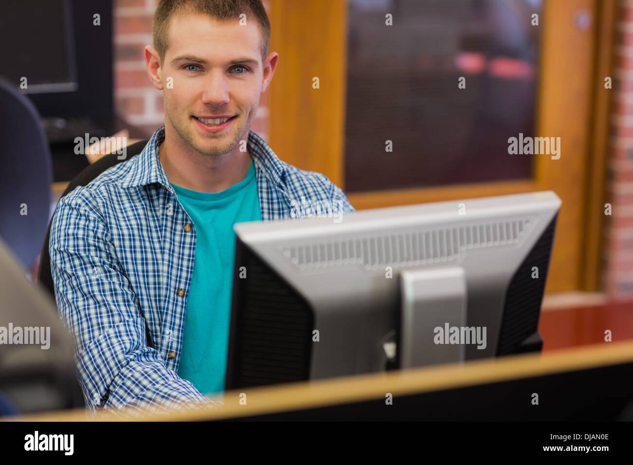 Male student using computer in the computer room Stock Photo - Alamy
