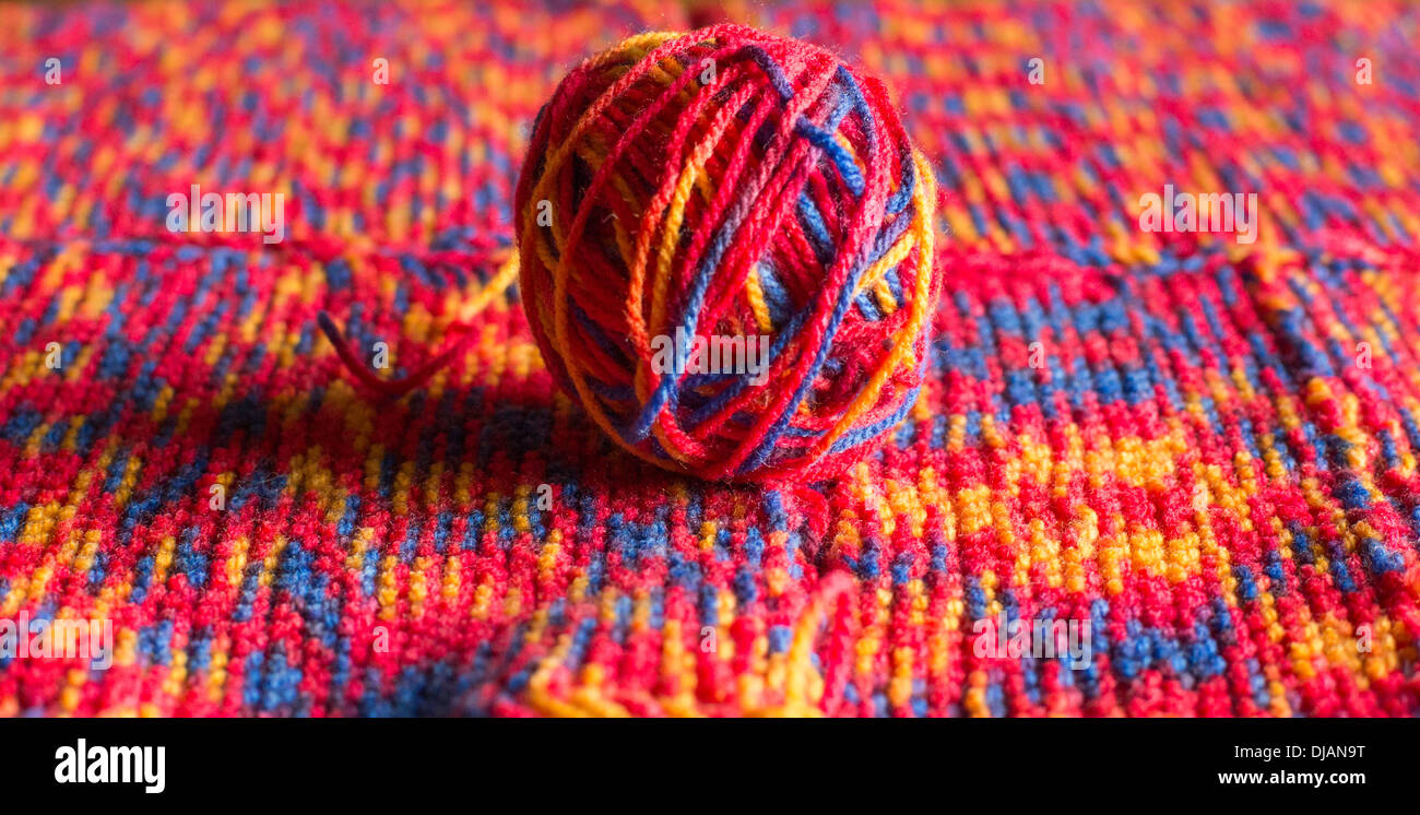 Colorful ball of wool on wool patch Stock Photo - Alamy