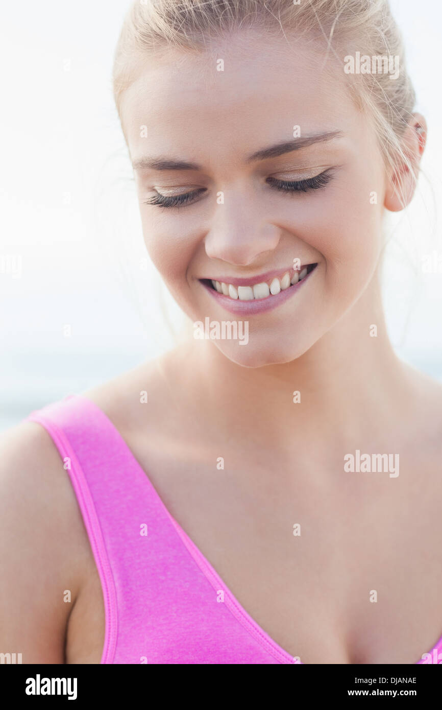 Close up of a smiling healthy woman looking down Stock Photo - Alamy