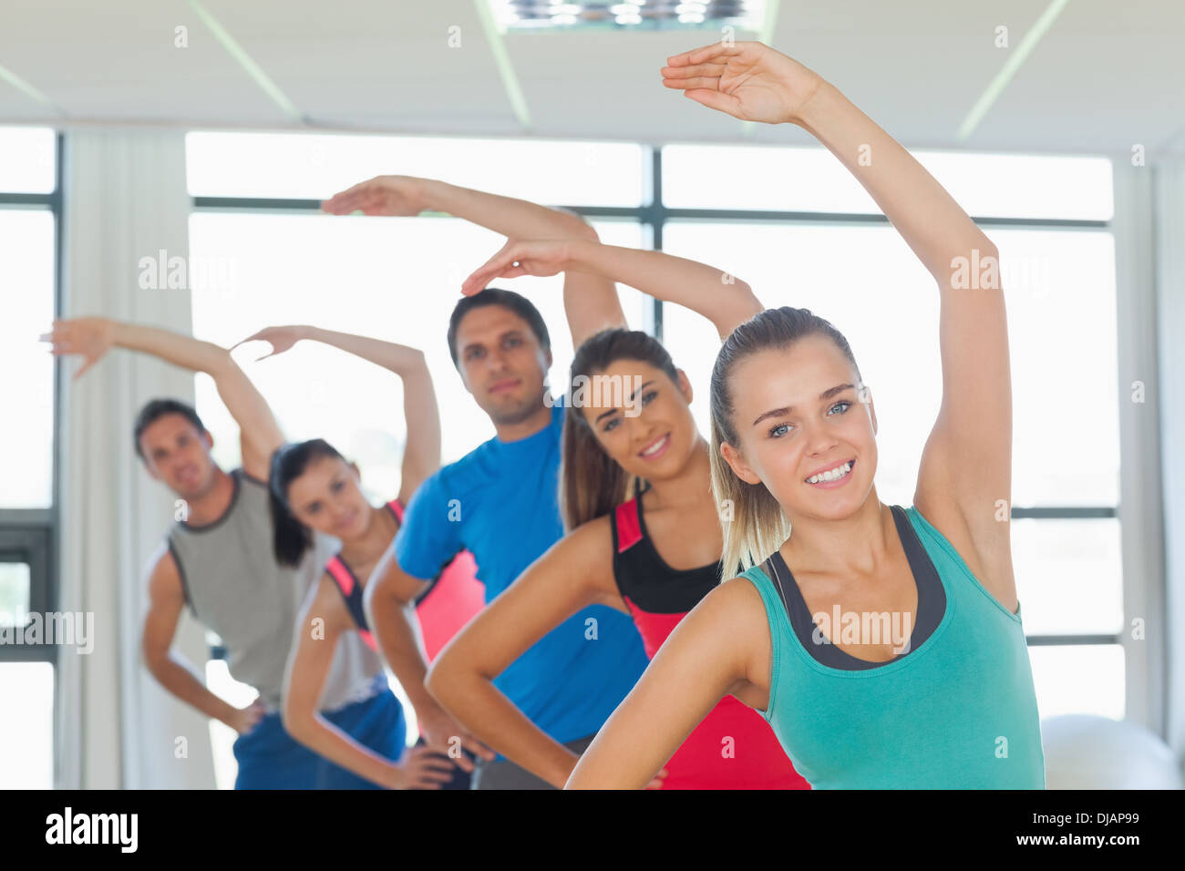 Group people exercising gym fitness man woman slim hi-res stock ...