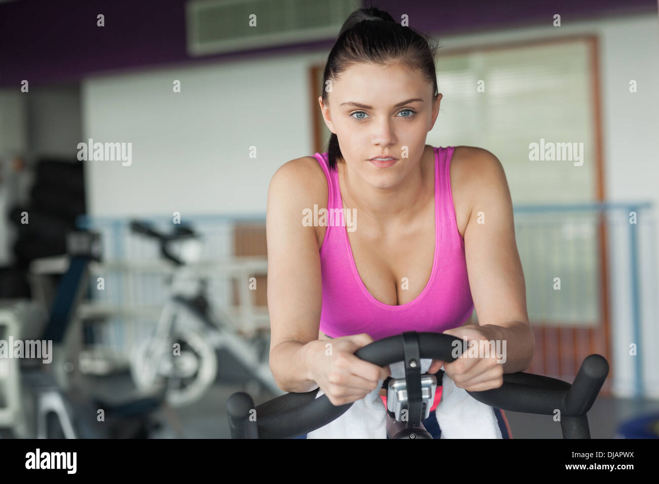 Portrait of a woman working out at spinning class Stock Photo - Alamy