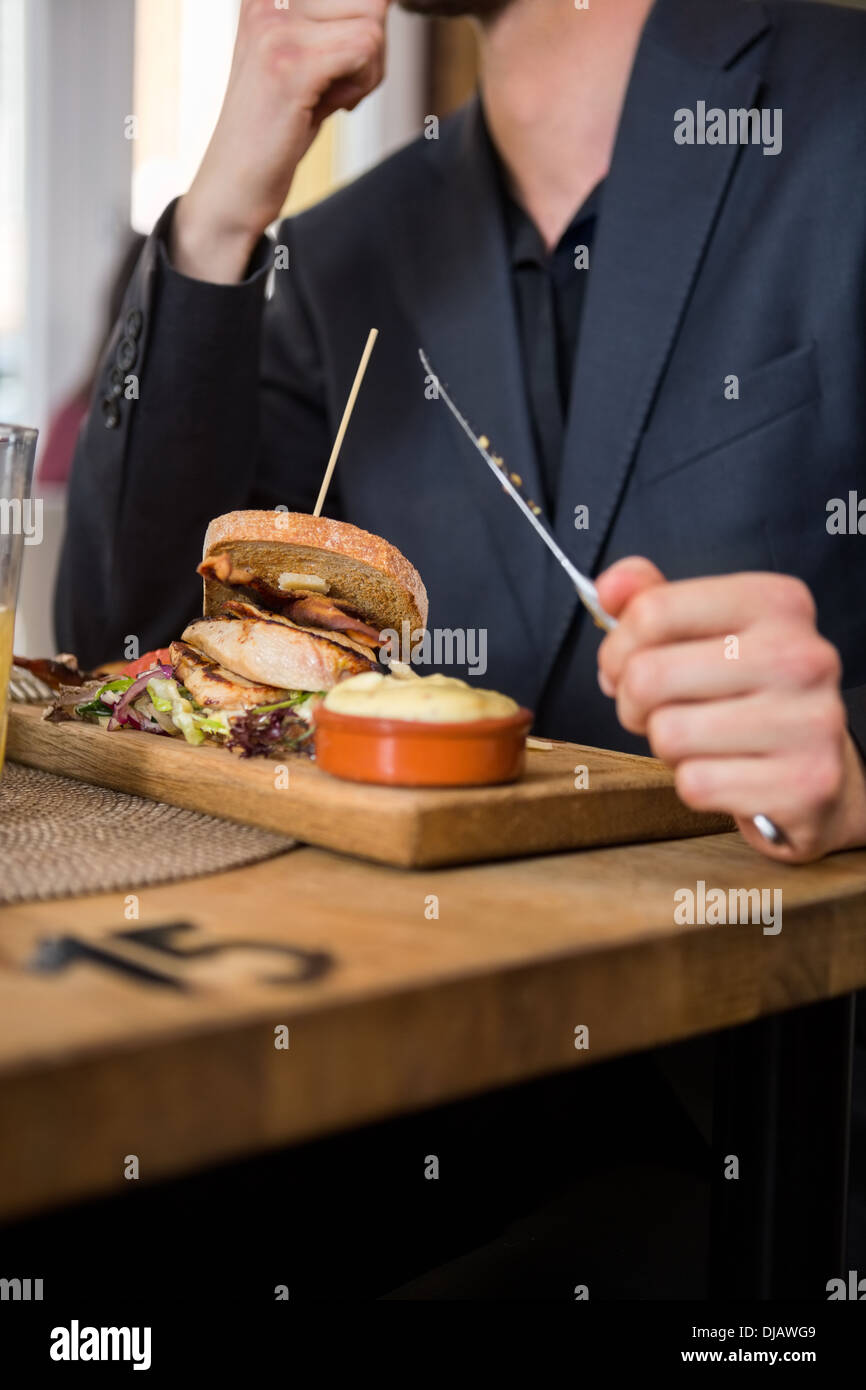 Businessman Eating Food In Restaurant Stock Photo - Alamy