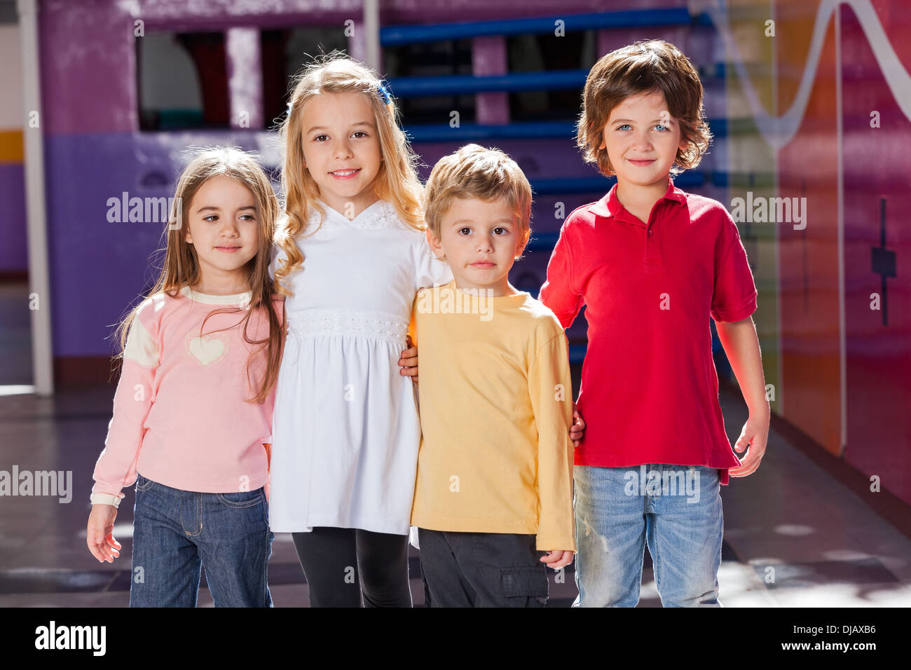 Children Standing Arms Around In Kindergarten Stock Photo - Alamy