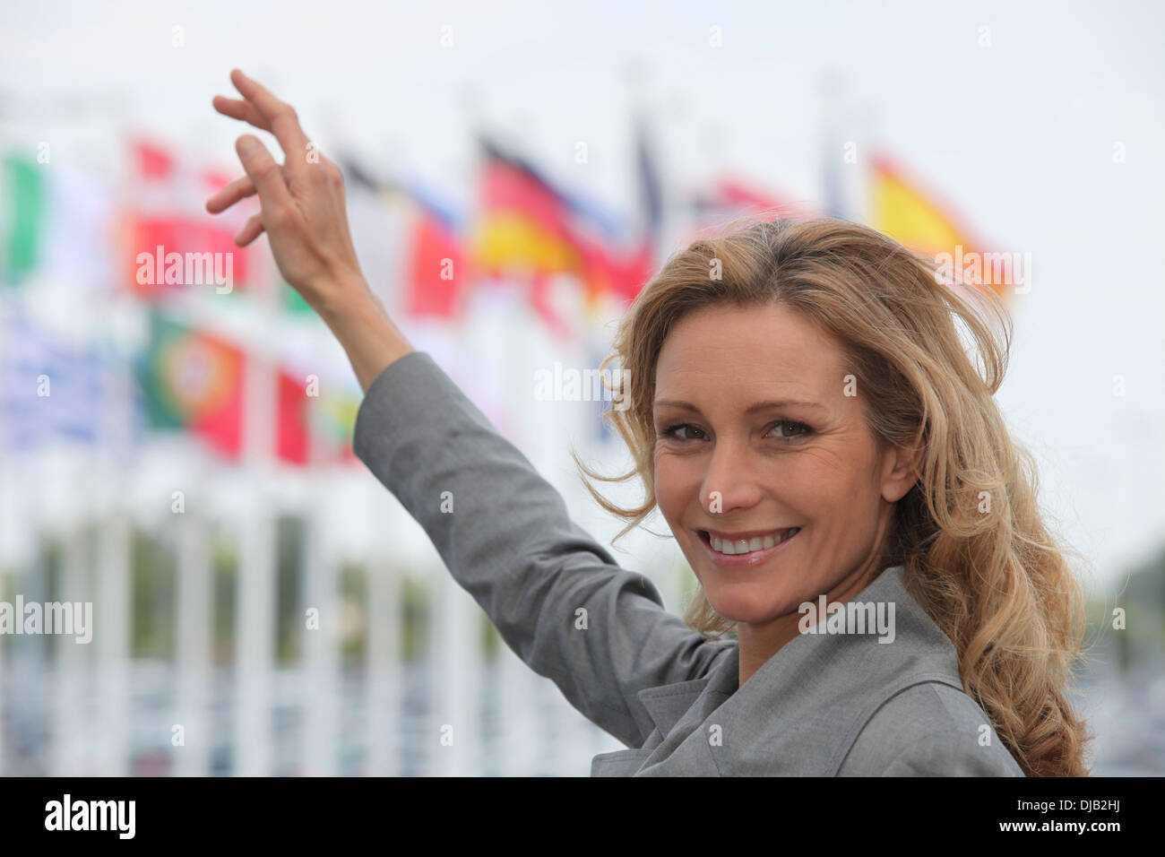 Woman pointing at flags Stock Photo - Alamy