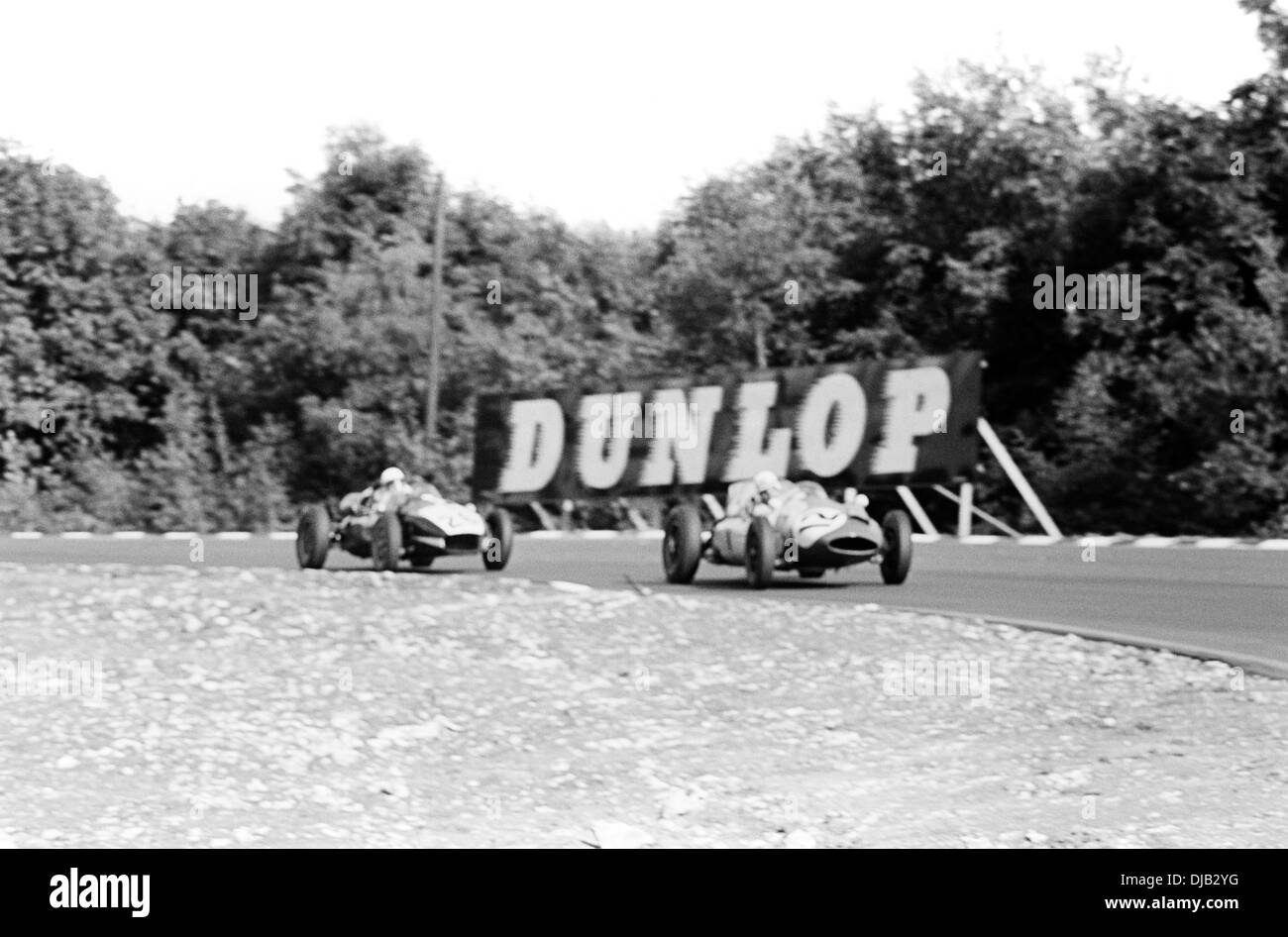 Henry Taylor in a Cooper T51 leading Jack Brabham, race winner, in ...