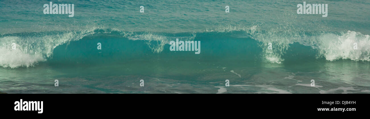 Breaking turquoise wave on a Majorca beach Stock Photo - Alamy