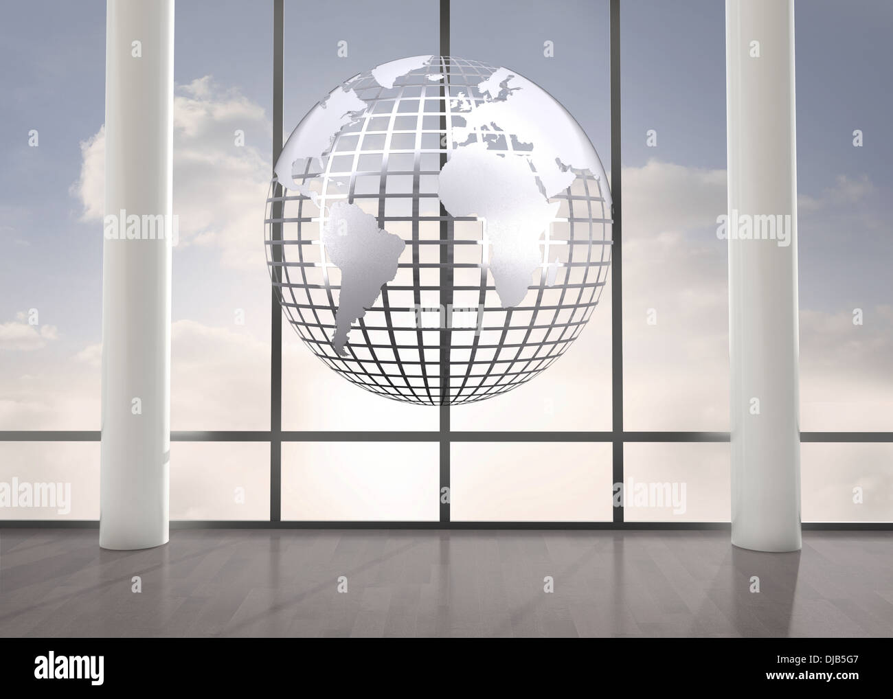 Silver globe floating in room Stock Photo - Alamy