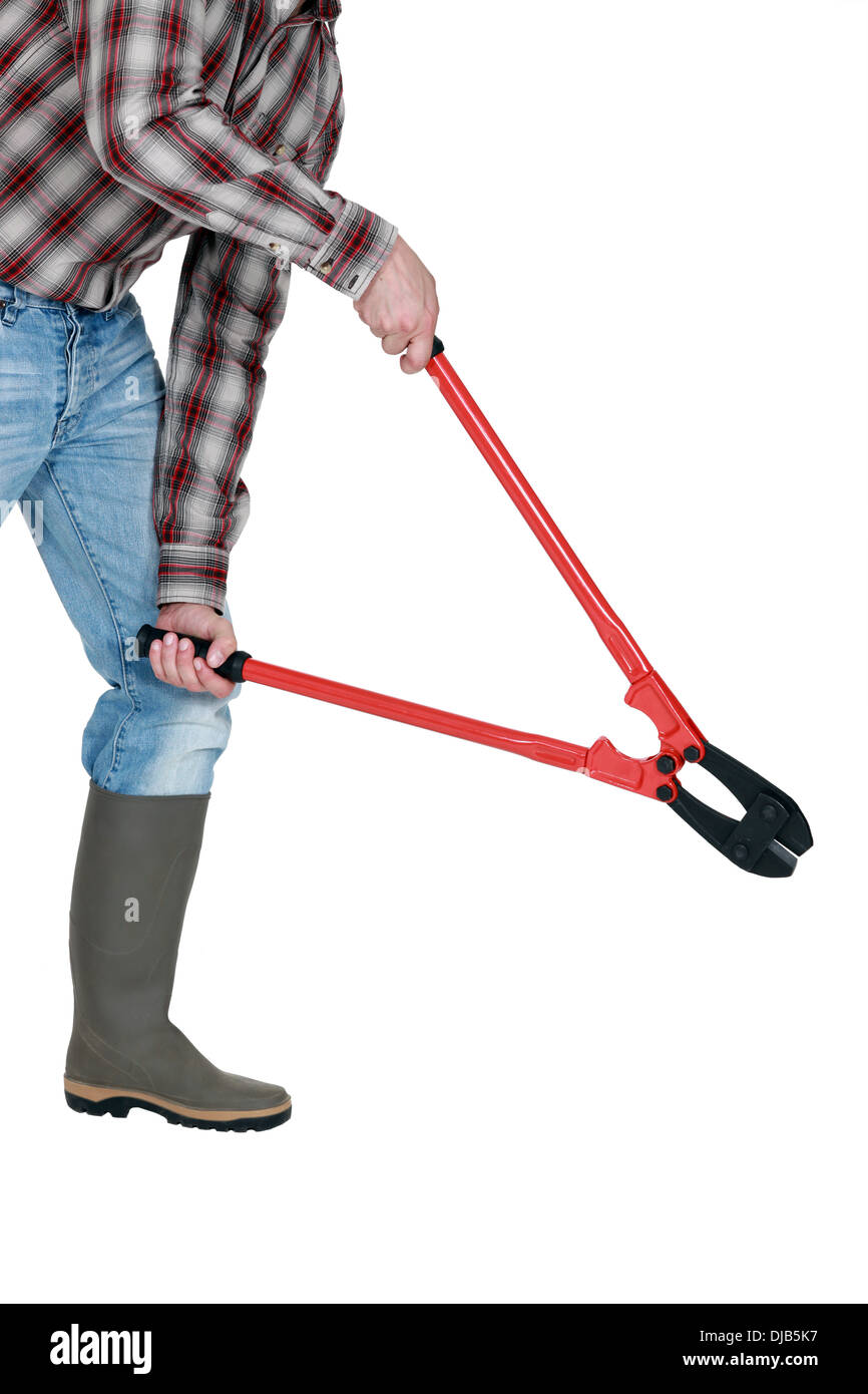 Man using heavy-duty cutter Stock Photo - Alamy