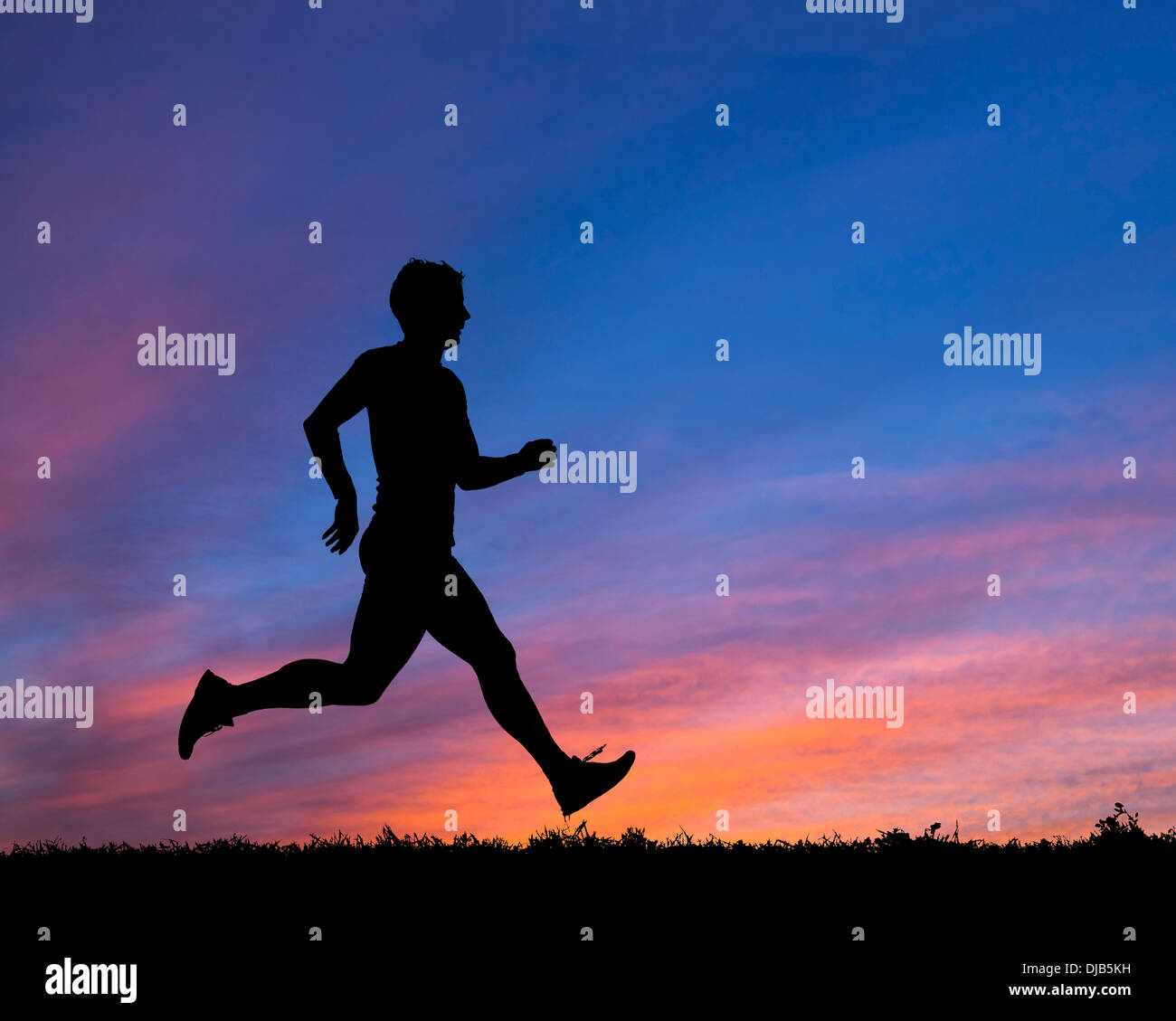 Silhouette of a jogger at sunset Stock Photo - Alamy