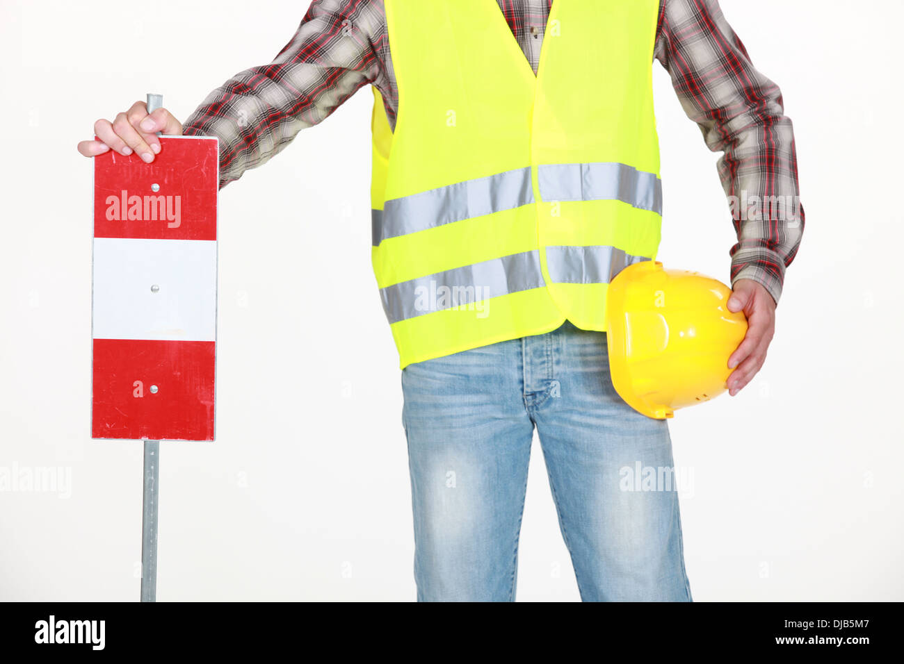Road worker with sign Stock Photo - Alamy