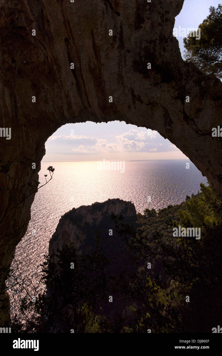Looking through the Arco Naturale ( natural arch ) rock formation to ...