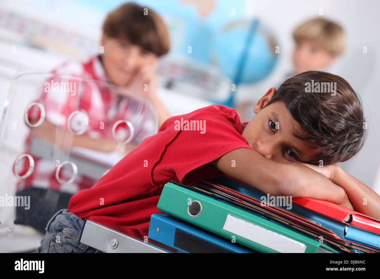 Child bored at school Stock Photo - Alamy