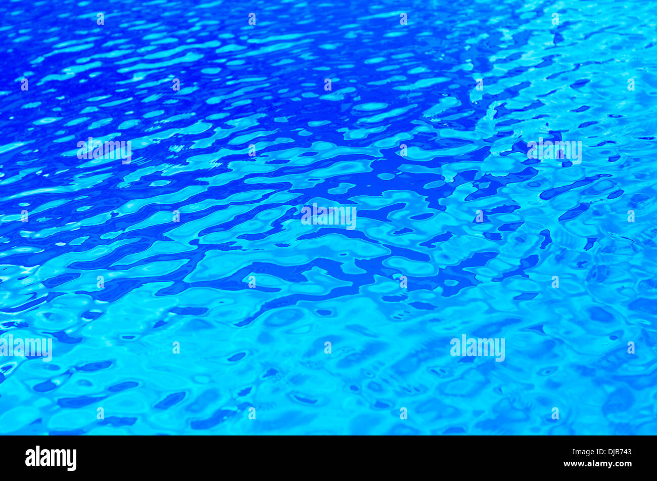 Bright blue water of the swimming pool Stock Photo - Alamy