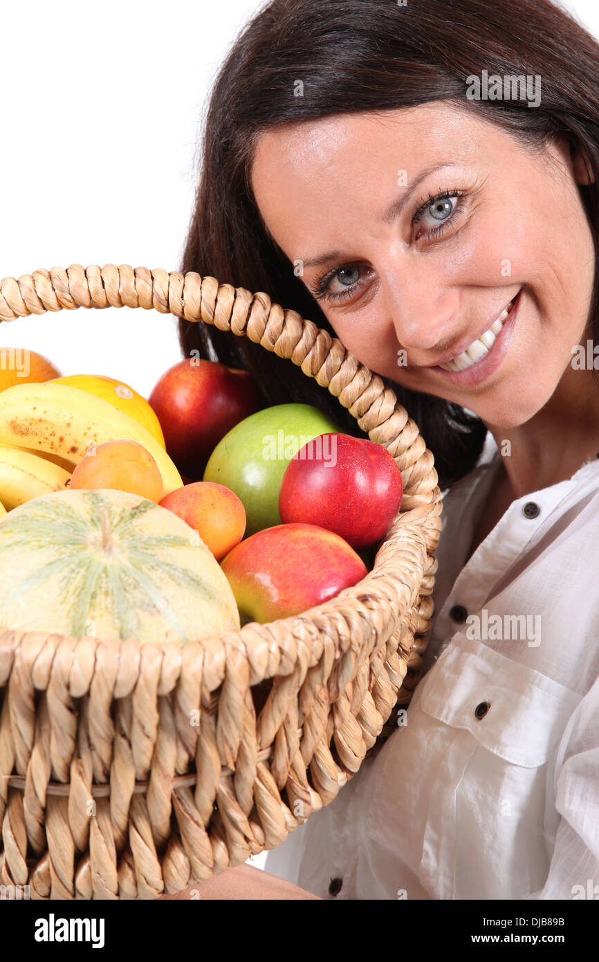 woman holding fruit basket Stock Photo - Alamy