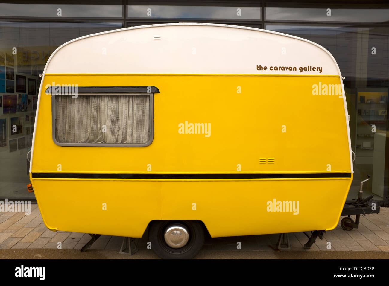 Bright Yellow Touring Caravan Art Gallery Stock Photo - Alamy