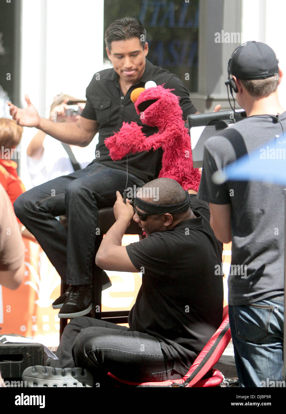Mario Lopez, along with Kevin Clash and his puppet, Elmo at The Grove ...