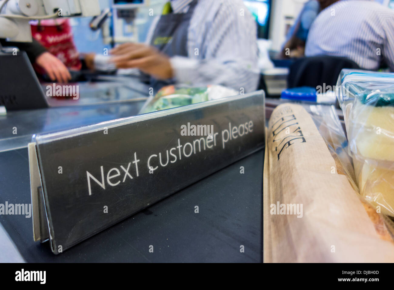 Supermarket checkout divider at Waitrose, UK Stock Photo - Alamy