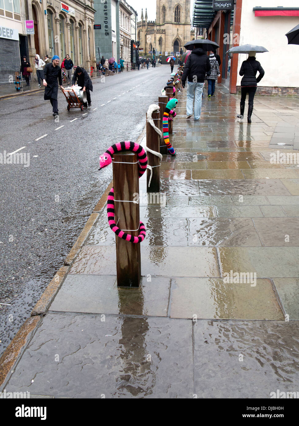 Knitted wool snake on public street art colourful Stock Photo - Alamy