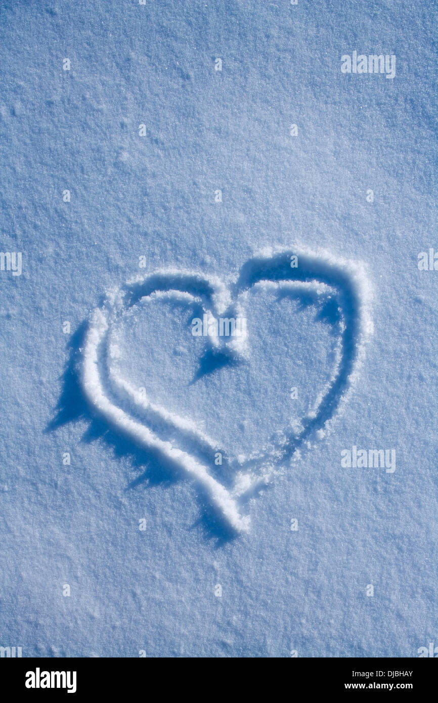 Drawing Of Heart In Blanket Of Fresh Snow Winter Alaska Stock Photo - Alamy