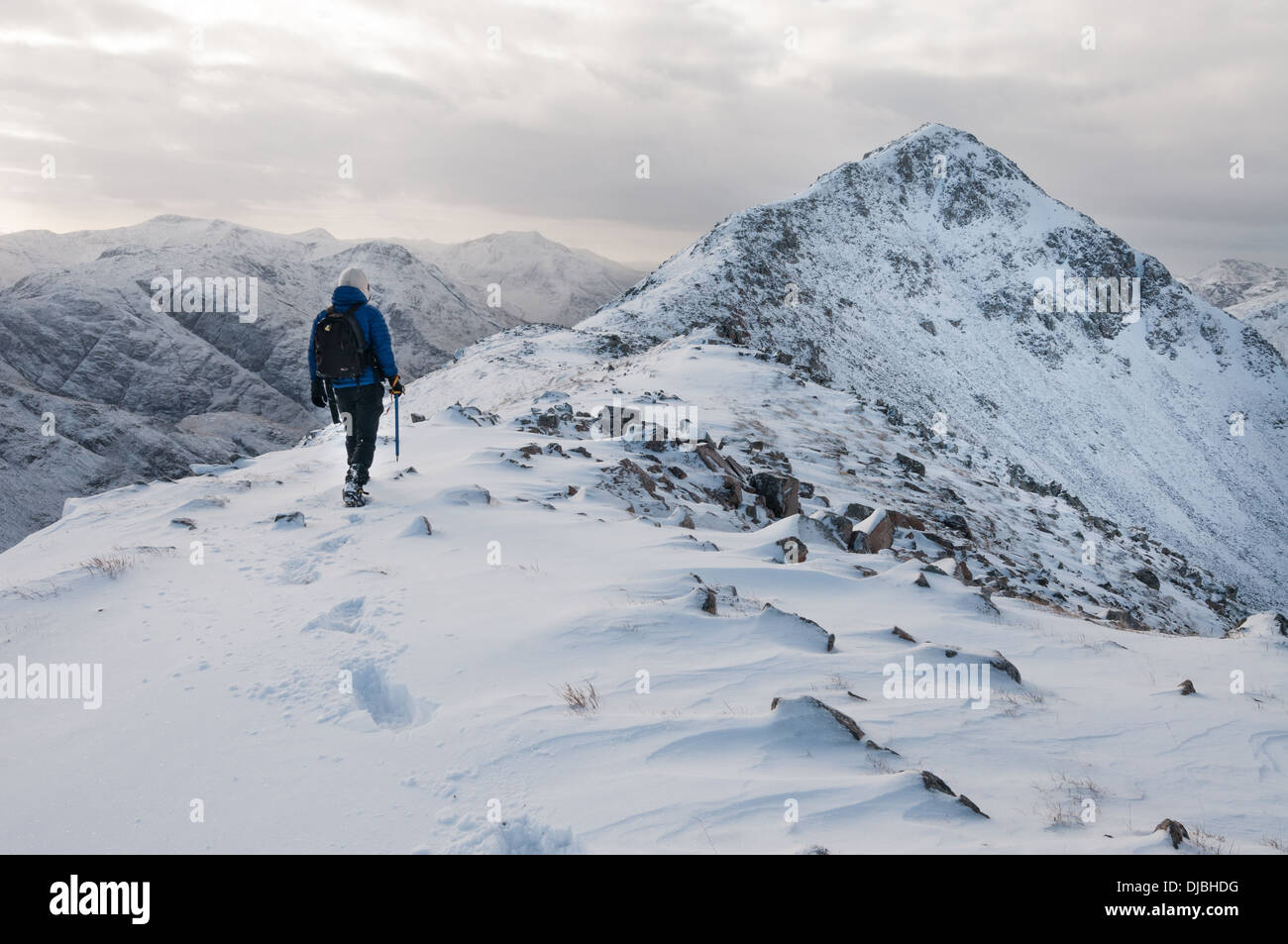 Scottish winter mountain walking. Male walker on Buachaille Etive Beag ...