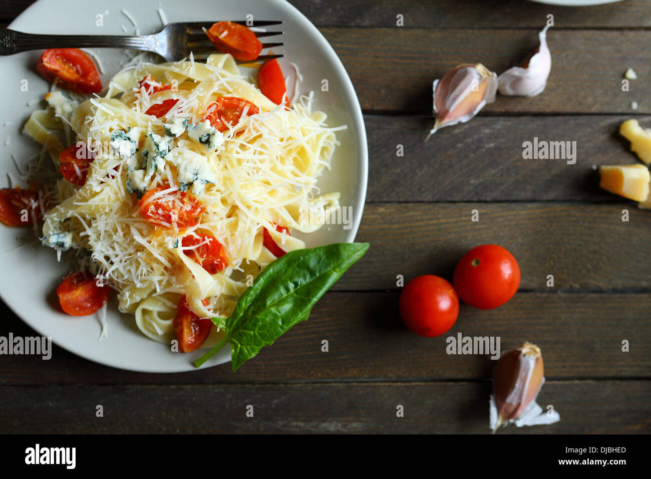 pasta with cheese and tomatoes, top view, food Stock Photo - Alamy