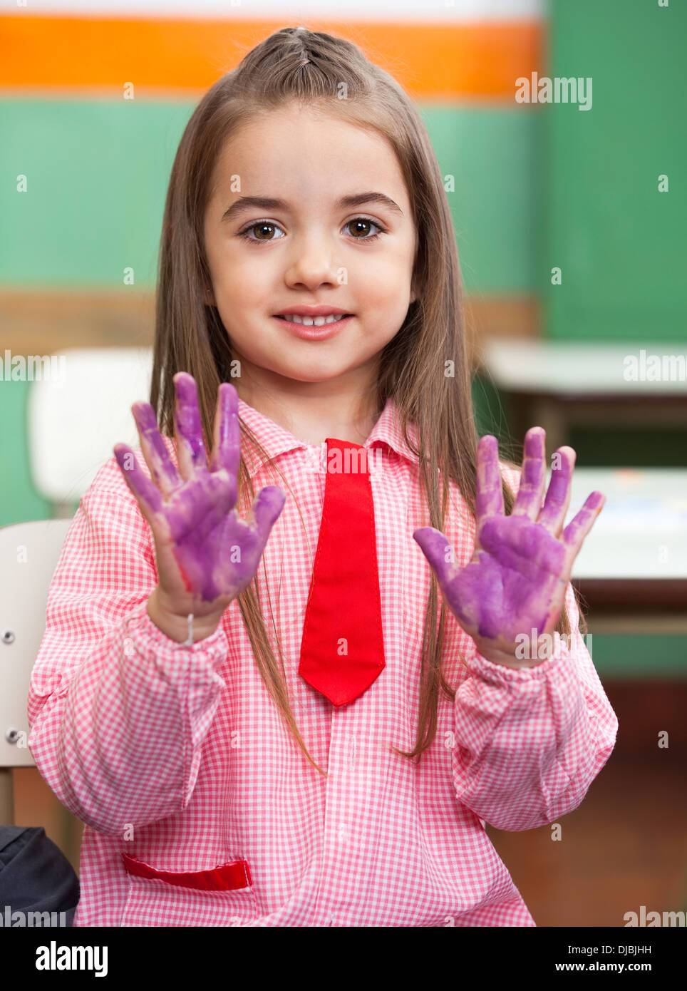 Girl Showing Colored Hands In Classroom Stock Photo - Alamy