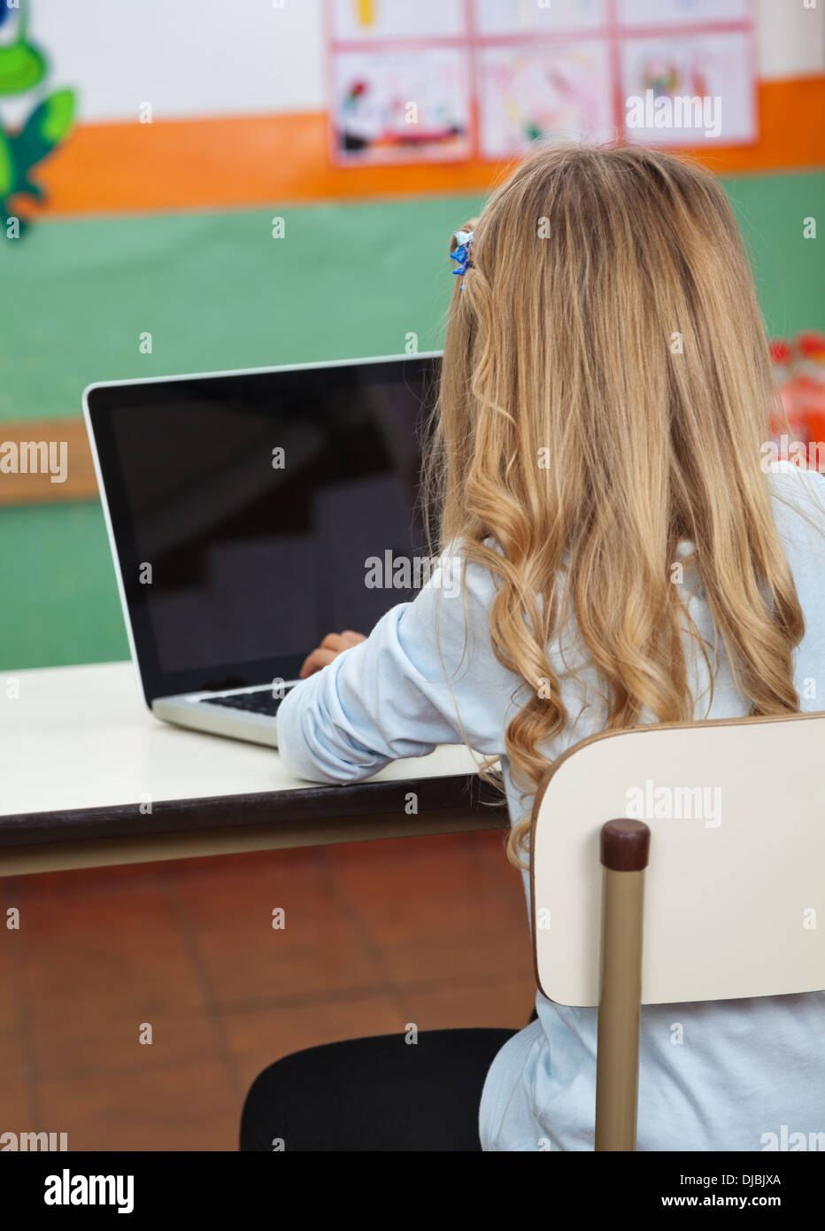 Little Girl Using Laptop In Preschool Stock Photo - Alamy