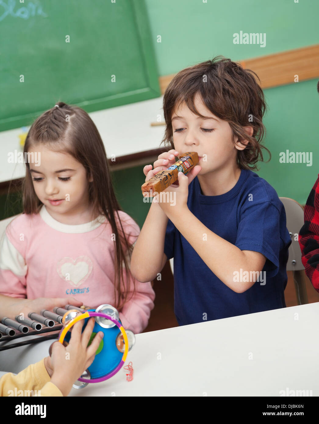 Children Playing Musical Instruments In Classroom Stock Photo - Alamy