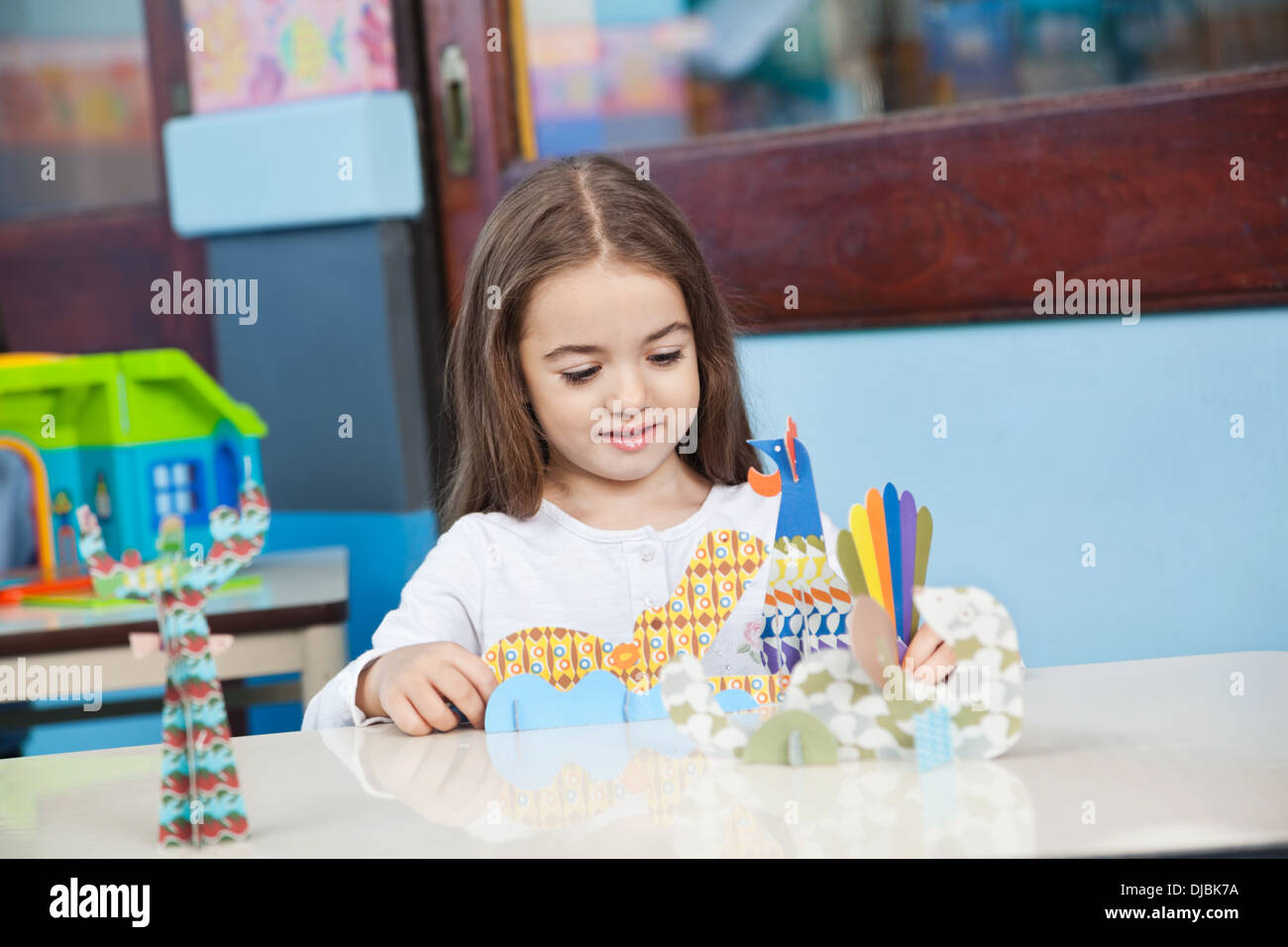 Girl Playing With Craft In Classroom Stock Photo - Alamy