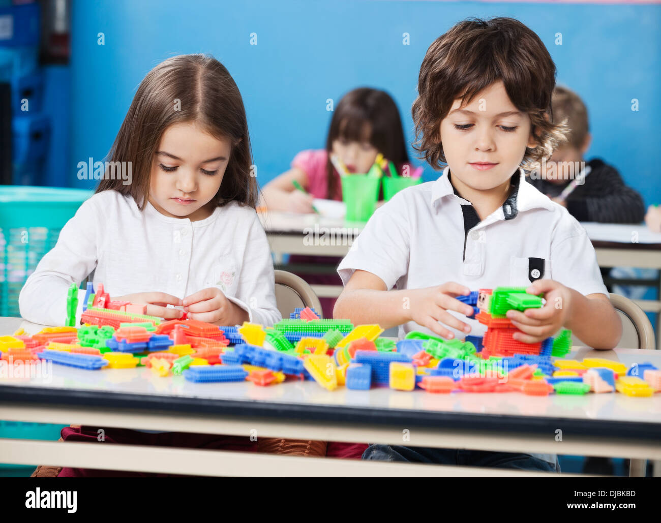 Children Playing With Construction Blocks In Classroom Stock Photo - Alamy