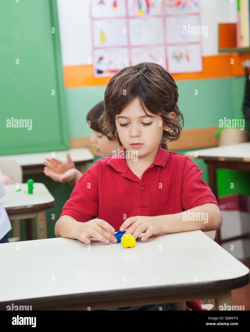 Child molding people clay hi-res stock photography and images - Alamy