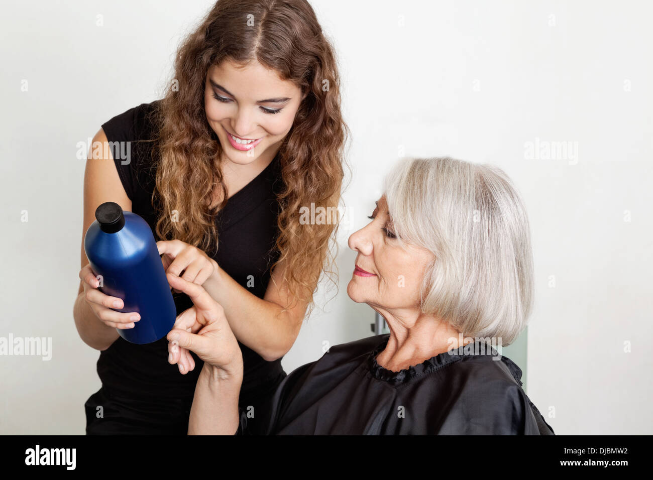 Hairdresser Advising Hair Color To Client Stock Photo - Alamy