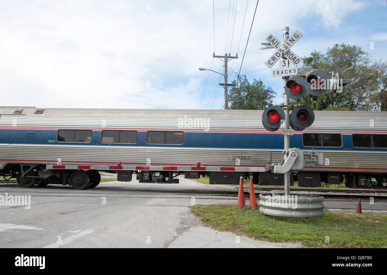 Amtrak passenger train passing level crossing at DeLand Florida USA ...