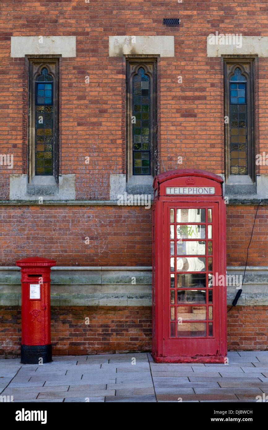 Red Telephone Box and Post Box against a building Stock Photo - Alamy